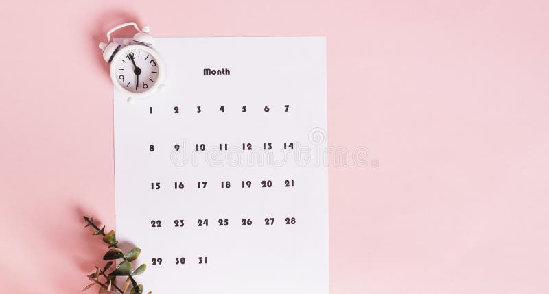 Monthly Calendar for Planning Tasks and Alarm Clock on Pink Top View ...