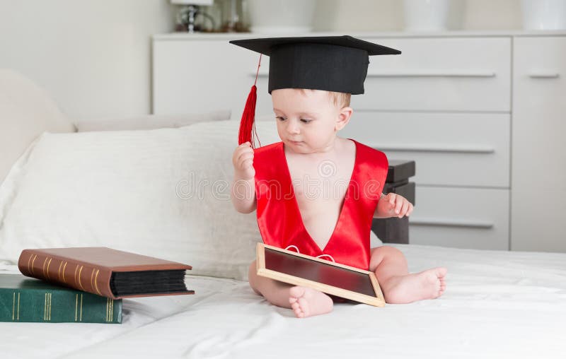 10 Months Old Baby Boy in Graduation Cap Holding Digital Tablet Stock ...