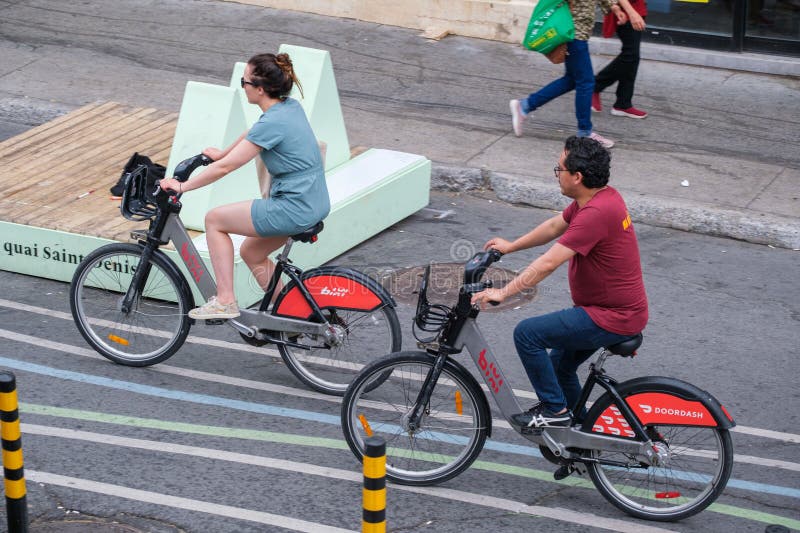 Two People Riding Biki Shared Bikes Editorial Stock Photo - Image of ...