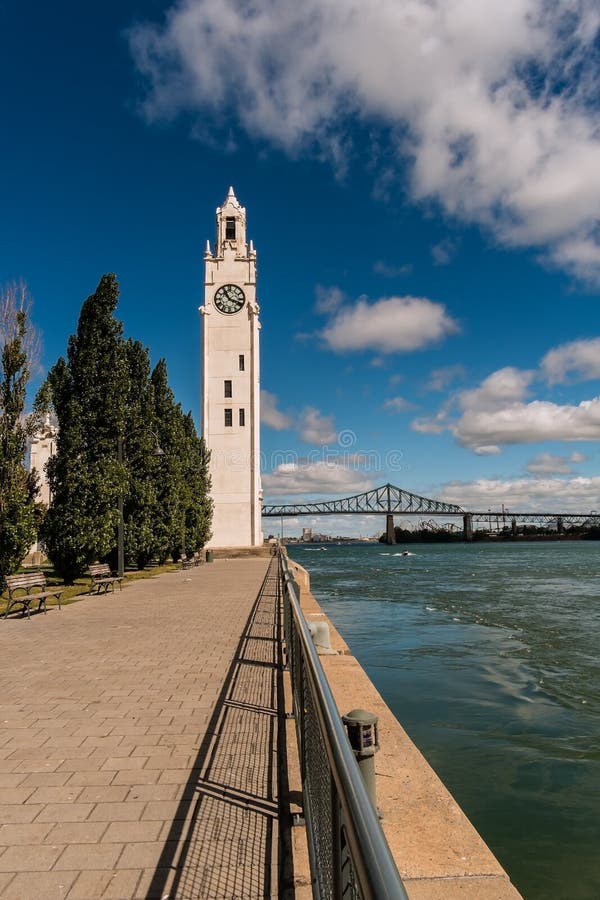 The Montreal Clock Tower with the Saint Lawrence Seaway in the Old Port ...