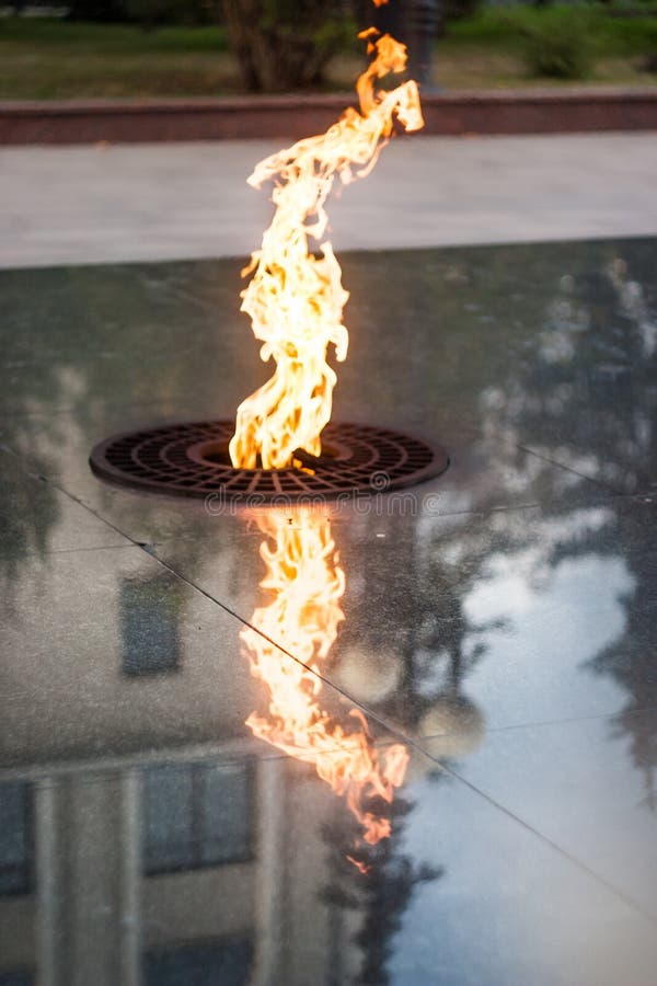 Monument `Eternal Flame`. Reflection in the Granite Surface. Editorial ...