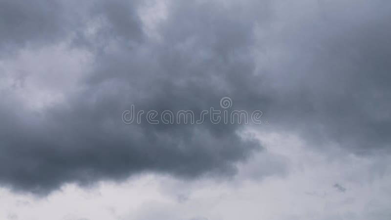 Moody Overcast Sky with Grey and Dark Blue Rain Clouds Slowly Drifting ... Moody Overcast Sky with Grey and Dark Blue Rain Clouds Slowly Drifting ...
