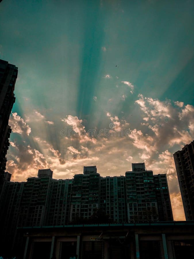 Moody Shining Sunset through Clouds Stock Image - Image of glazing ...