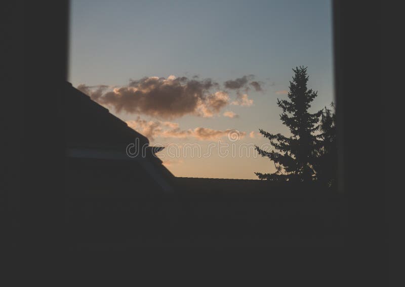 Moody sunset out of window stock photo. Image of modern - 147495926