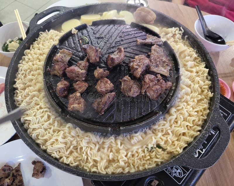 Mookata Cooking Instant Noodles and Meat Stock Image - Image of meat ...