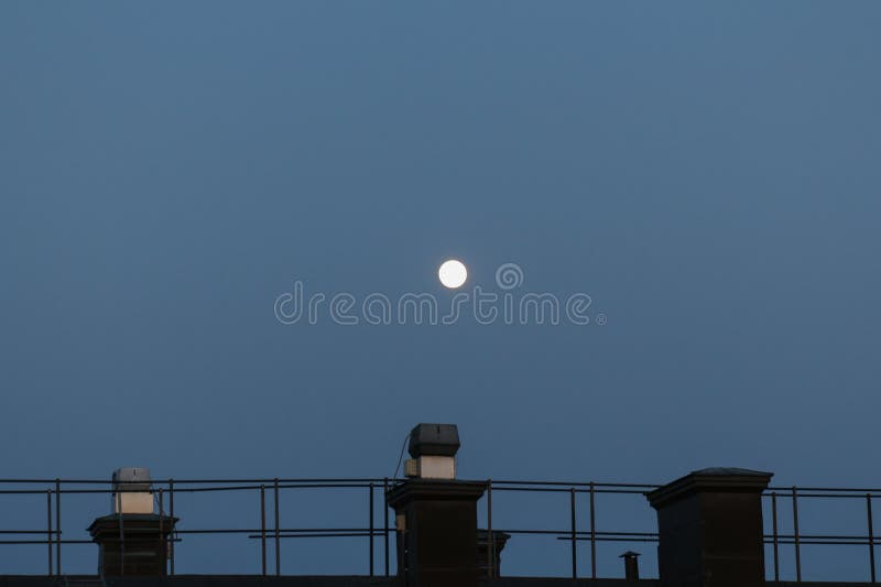 The Moon Above the Rooftop at Night Stock Photo - Image of rooftop ...
