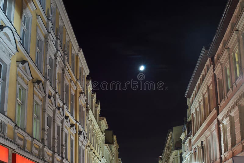 The moon above the street stock photo. Image of building - 78328692