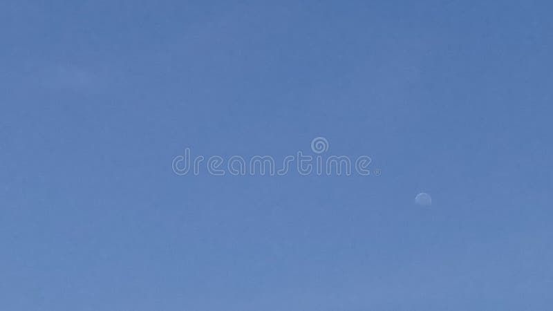 The moon appears at noon stock image. Image of noon - 322751049