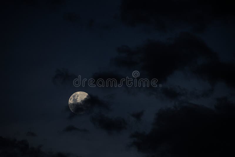 Moon Behind the Cloudy Dark Sky Stock Photo - Image of cloudy, planet ...