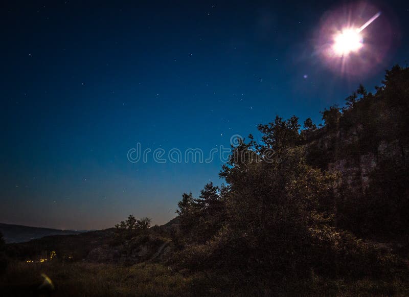 The Moon Behind a Tree at Dusk Stock Photo - Image of trees, border ...