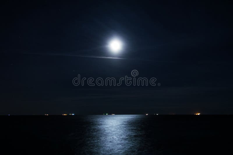 The Moon in the Clear Night Sky Over the Sea. Stock Image - Image of ...