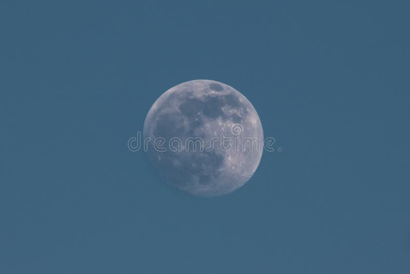 Moon in Daytime Against Dark Blue Sky Over Germany Stock Photo - Image ...