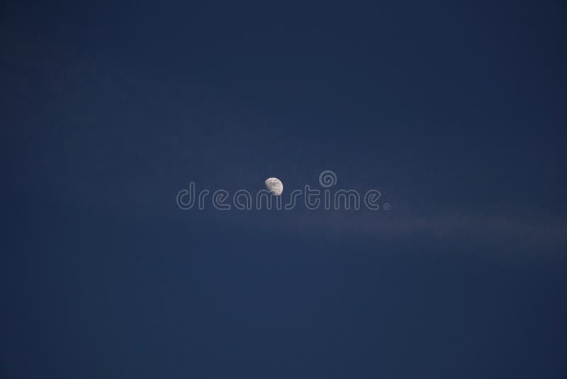 Moon in the evening sky stock photo. Image of multimedia - 268110252