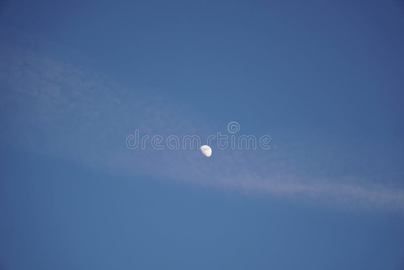 Moon in the evening sky stock image. Image of lunar - 268110245