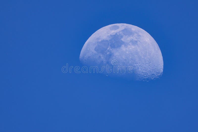 Moon fading in a blue sky stock photo. Image of beautiful - 262429900