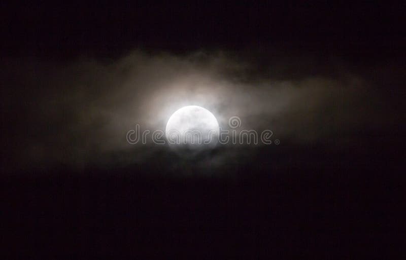 The Moon in the Haze of the Clouds at Night Stock Photo - Image of ...
