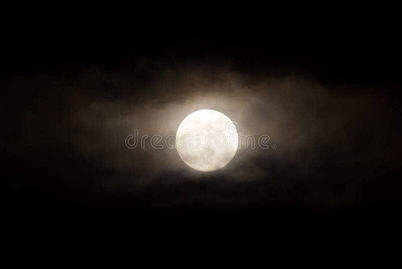 The Moon in the Haze of the Clouds at Night Stock Photo - Image of ...