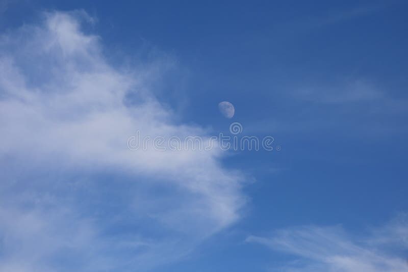 Moon Just Risen and Barely Visible during the Day in the Blue Sk Stock ...