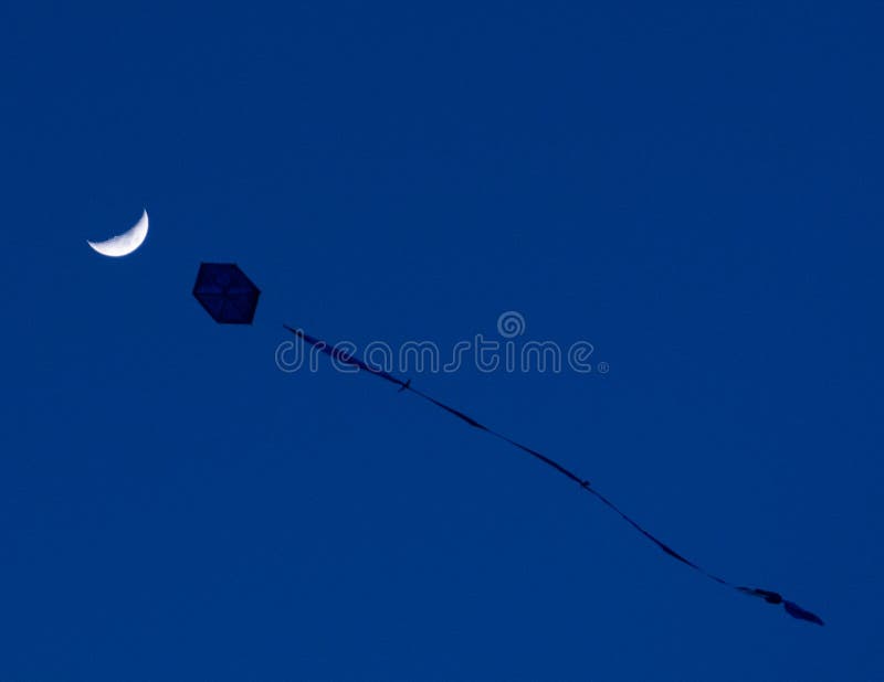 Moon with kite in the sky stock photo. Image of screenshot - 215080816