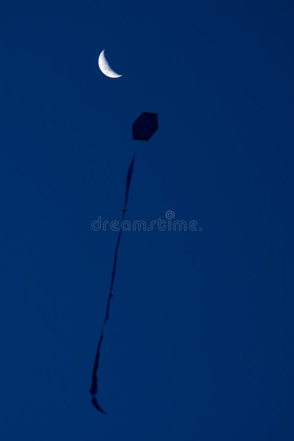 Moon with kite in the sky stock photo. Image of poster - 215080912