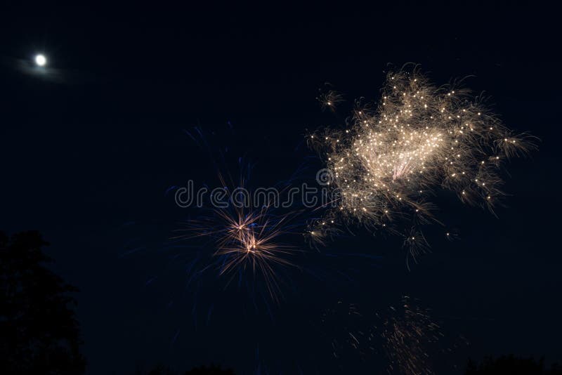 Moon Looks Over Fireworks stock image. Image of noise - 215089425