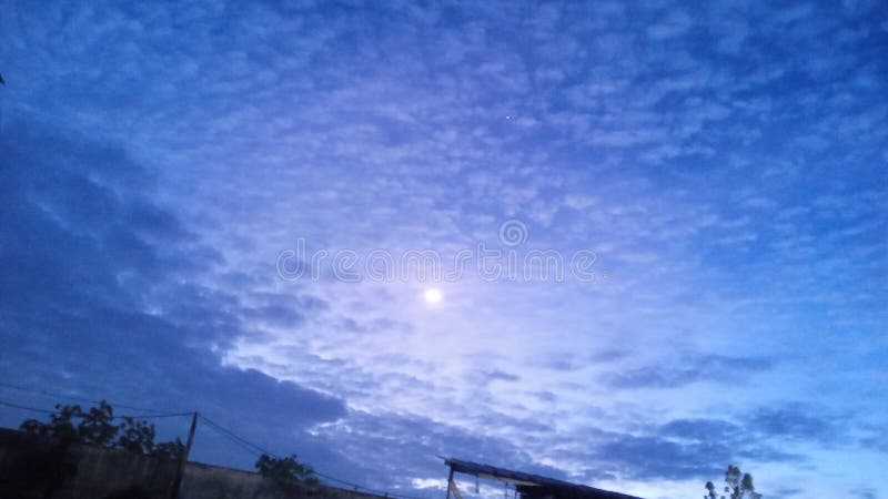 Moon in the Morning Blue Sky with Beautiful White Clouds Stock Image ...