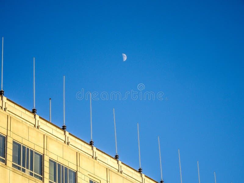 Moon over a building stock image. Image of rooftop, antenna - 80167421