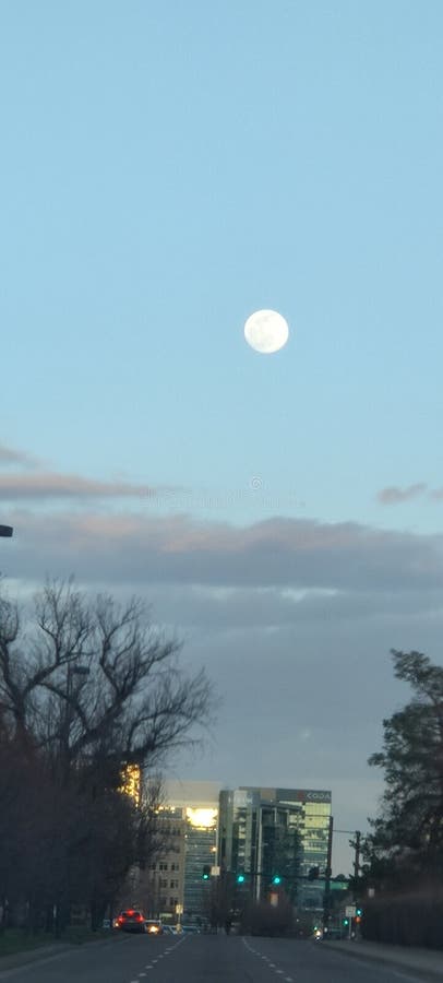 Moon over city editorial stock image. Image of streetlight - 217961579