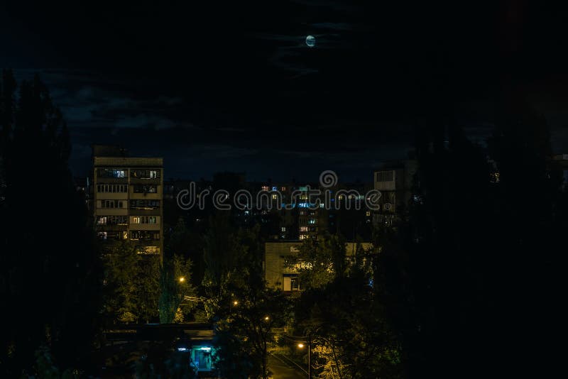The Moon Over the Night Sleeping Area of the City in the Clouds Stock ...