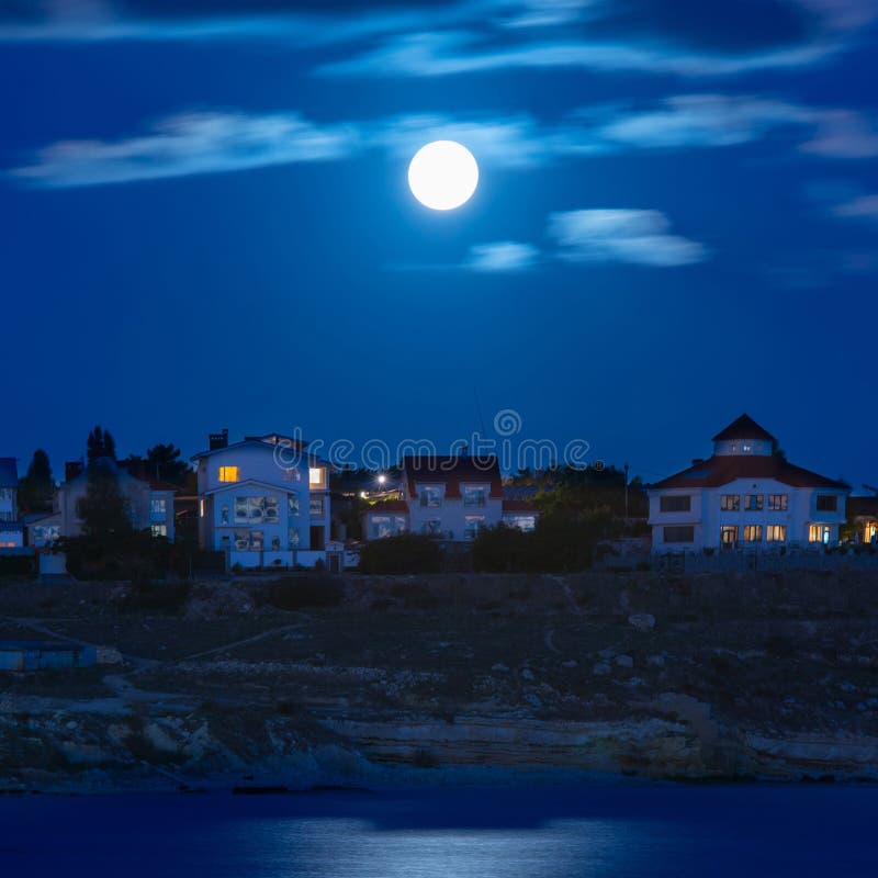 Moon over the town stock image. Image of cityscape, glowing - 48912775