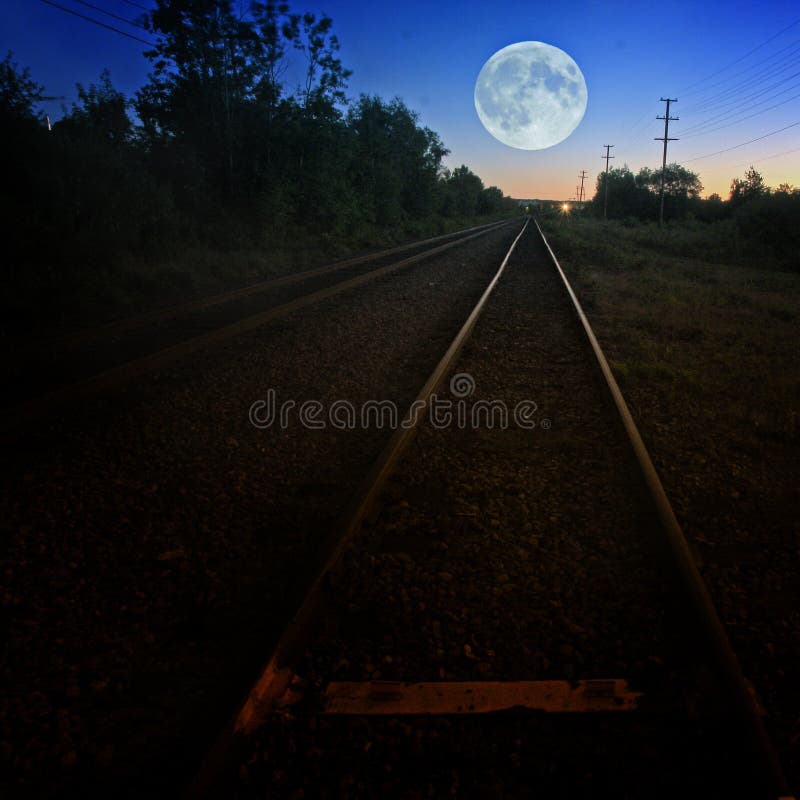 Moon over tracks stock image. Image of night, large, floating - 94032679