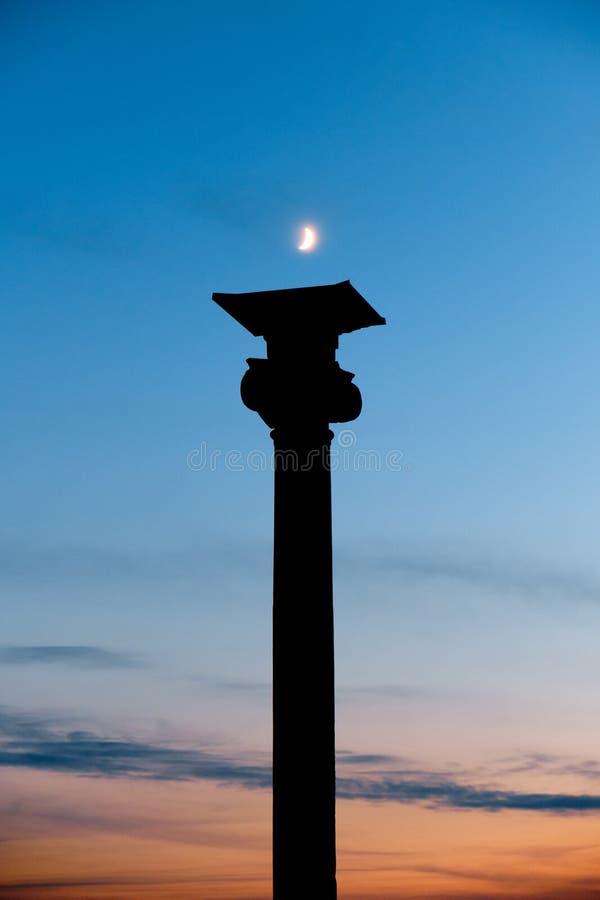 Moon and Pillar in the Sunset Sky Stock Photo - Image of landmark, city ...