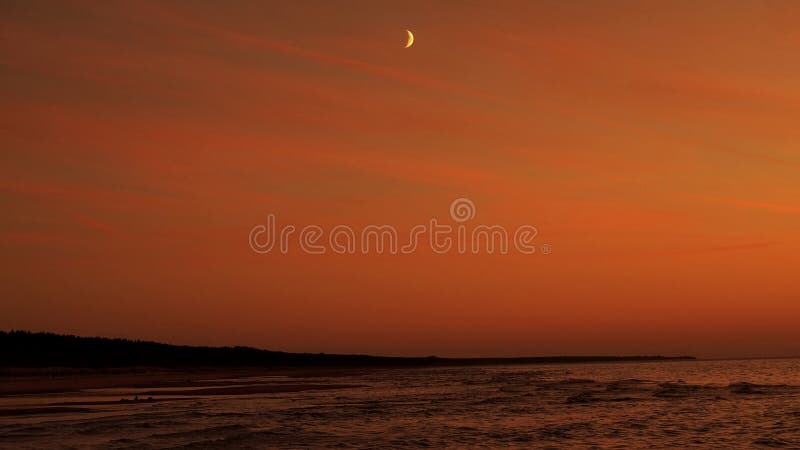 Moon and red sky at sunset stock image. Image of nightscape - 58232055