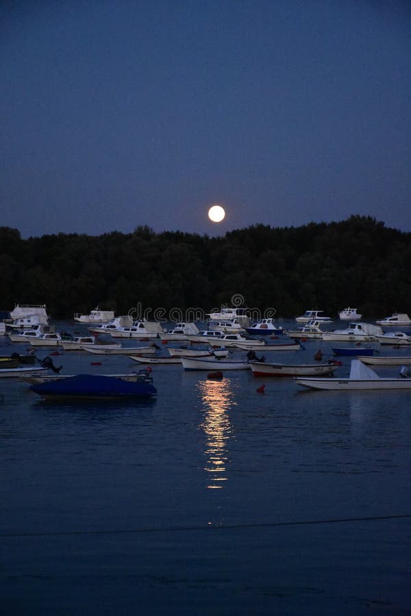 The Moon and the Reflection of the Moon on a Pool of Water Editorial ...