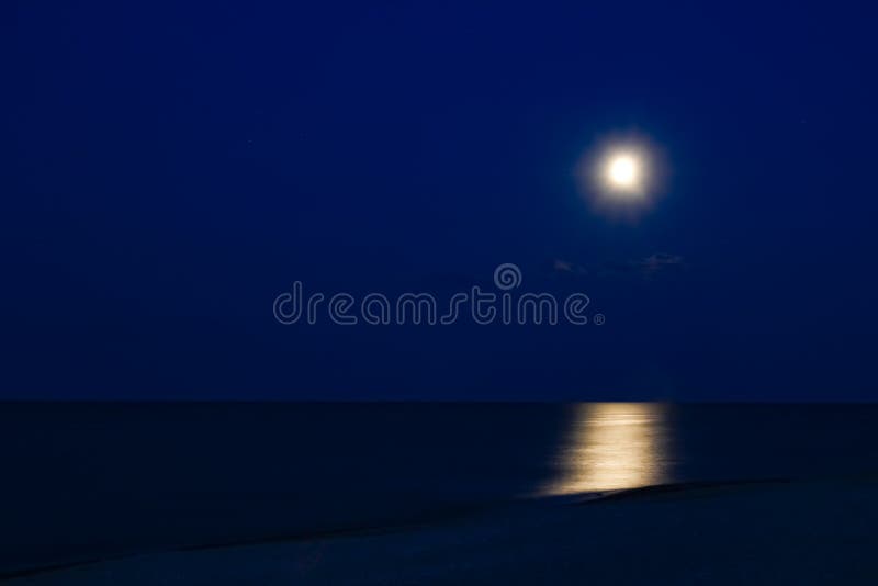 A Moon with Reflection by the Sea on Nature Background Stock Image ...