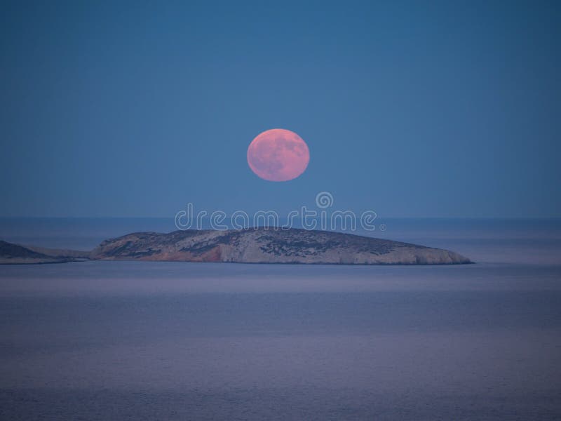 The Moon Rise from the Horizon Shortly after Sunset Stock Photo - Image ...