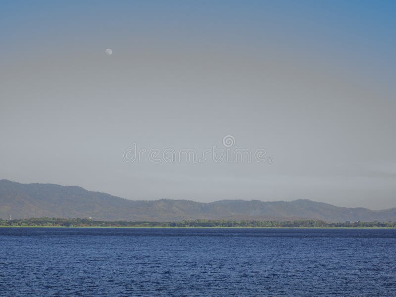 Moon Rise from the Afternoon Above a Dam Stock Photo - Image of noon ...