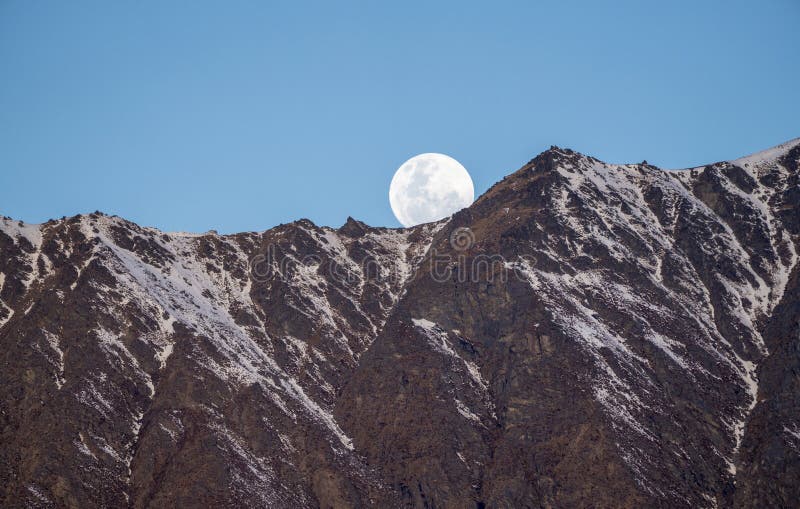 Moon Rise Over the Mountains on the Blue Sky Background Stock Photo ...
