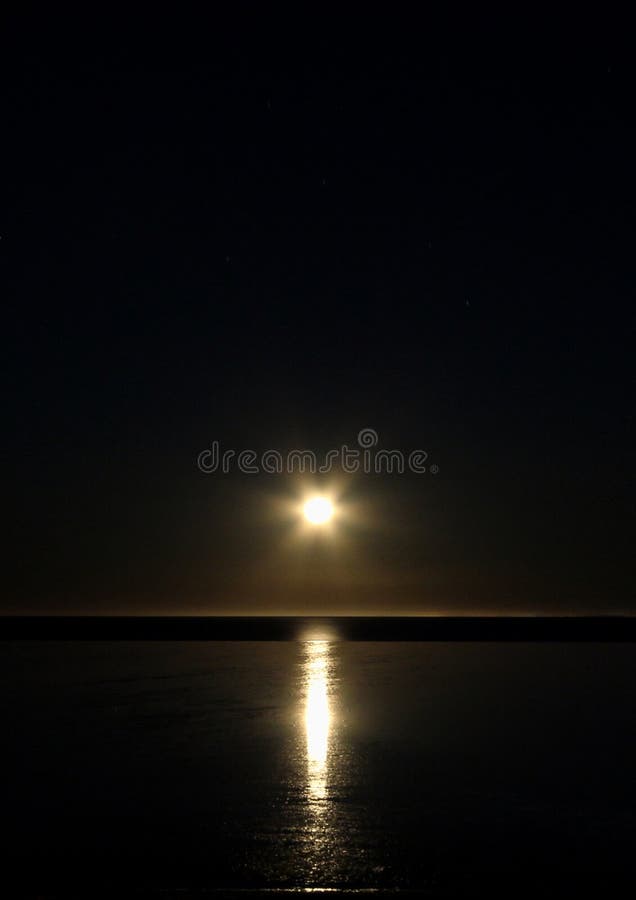 Moon rise over ocean stock photo. Image of lunar, surface - 101025262