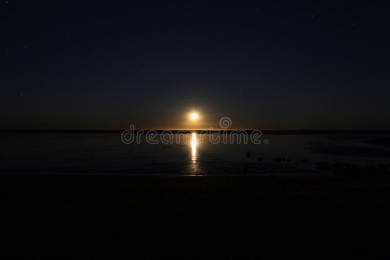Moon rise over ocean stock image. Image of astronomy - 101025645