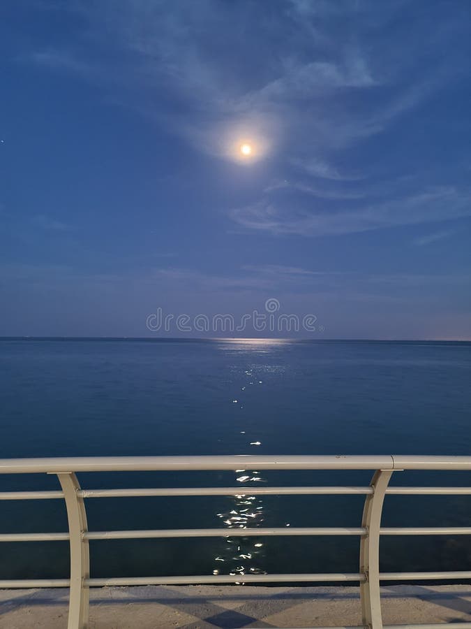 Moon rise from the sea stock photo. Image of line, glass - 248137794