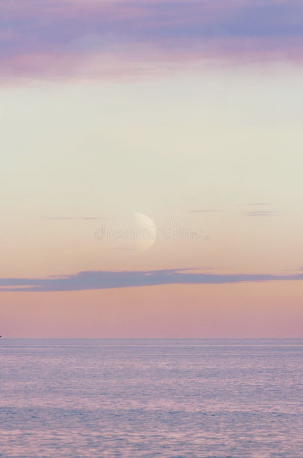 Moon rises at Sunset stock photo. Image of sunset, gradient - 258442498