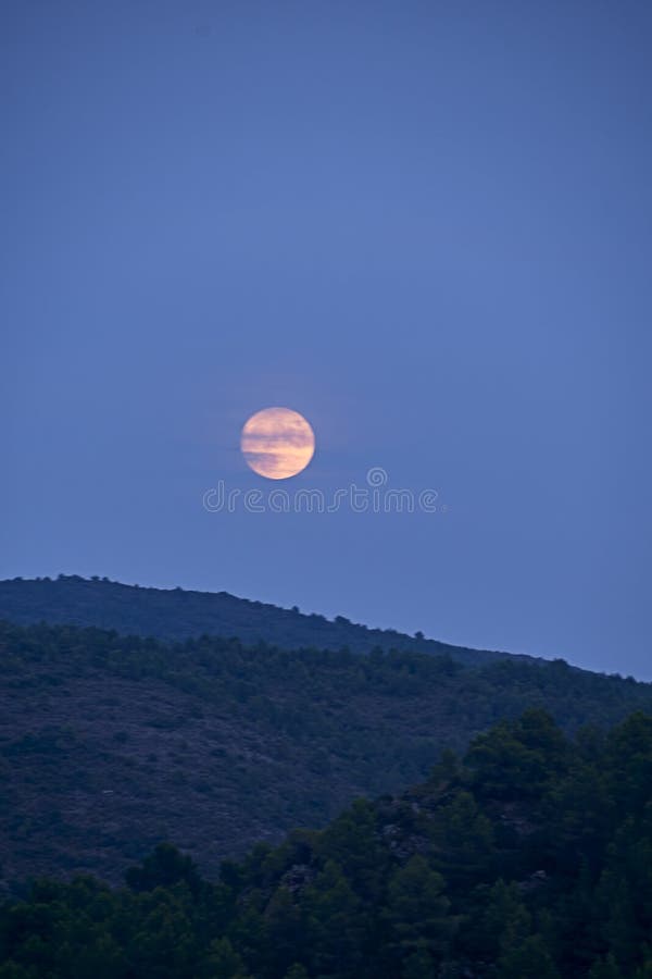 The Moon Rising between the Mountains Stock Image - Image of forest ...
