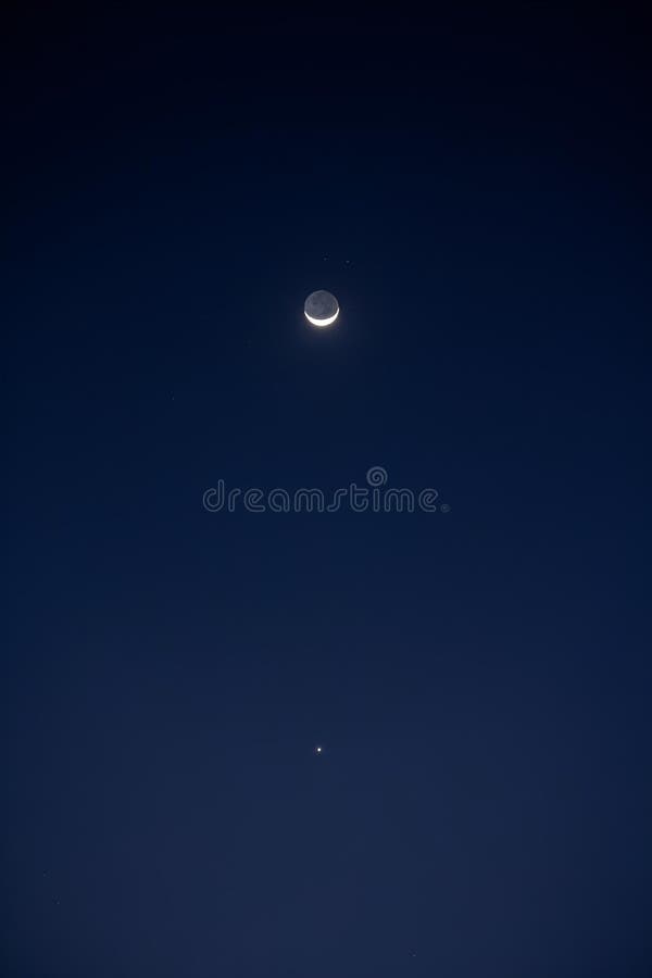 Moon Rising Over Dark Hills in Night Sky Stock Photo - Image of moon ...