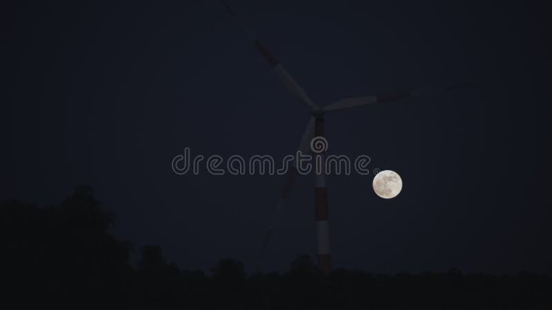 Moon and Rotating Wind Turbine at Night Stock Footage - Video of moon ...