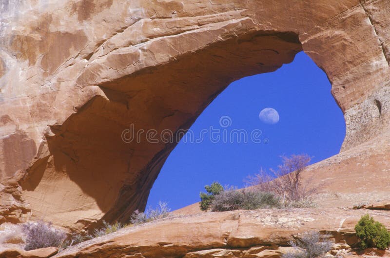 Moon Seen through Rock Formation Stock Image - Image of desert, western ...