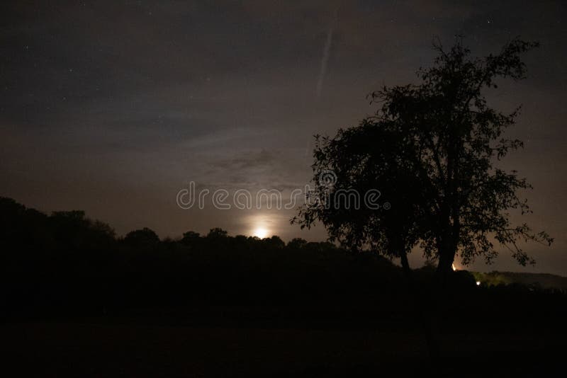 Moon Set Behind a Mountain Ridge Stock Photo - Image of ridge, moon ...
