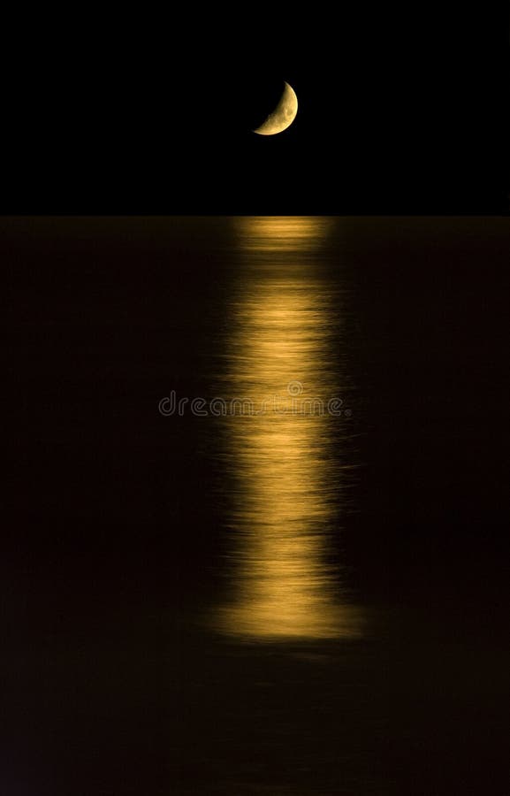 Moon setting on the ocean. stock image. Image of dreams - 12493099
