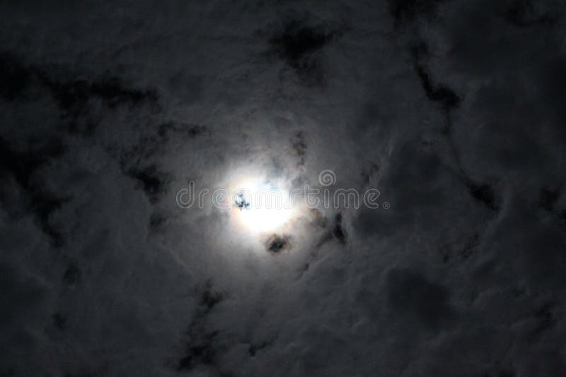 The Moon Shines in the Clouds on a Winter Cold Night. Stock Image ...