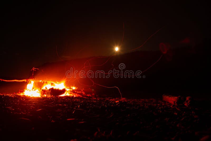 Moon Shining in the Night Sky Over the Burning Fire Stock Photo - Image ...